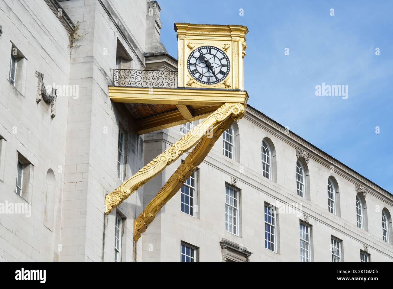 Leeds Millennium Square gold clock Stock Photo - Alamy