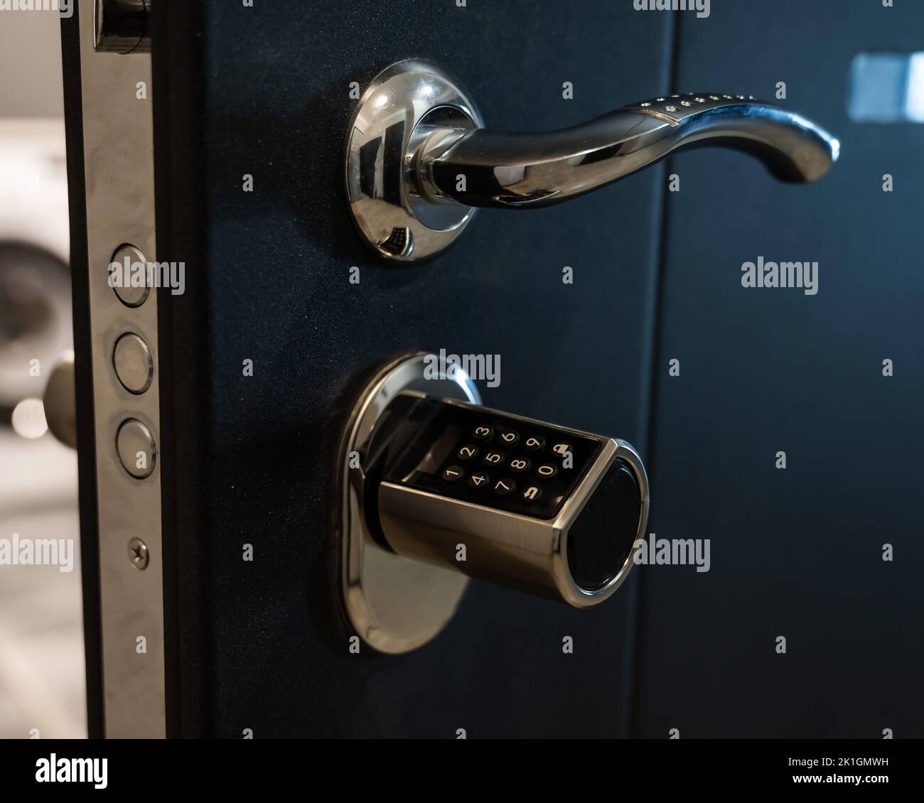 Open door to the apartment with a combination lock. Keyless entry Stock ...