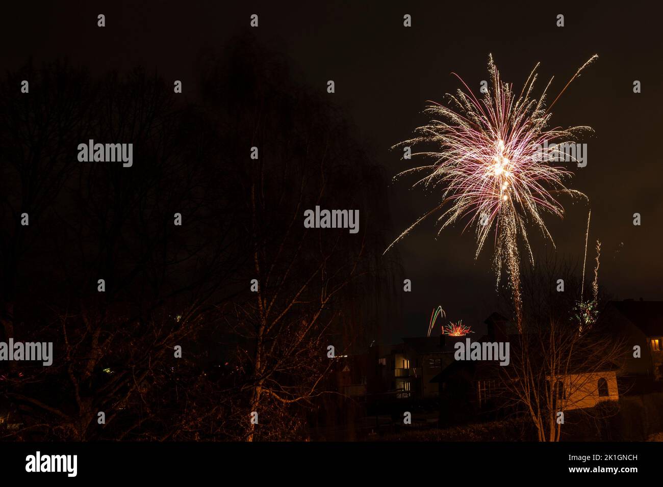 colorful spark stars of a New Year's Eve rocket Stock Photo - Alamy