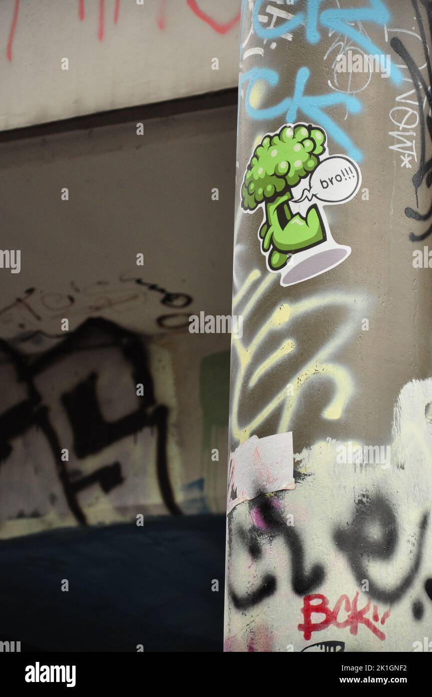 A vertical closeup shot of a graffiti and sticker on lanternon Tesnov ...