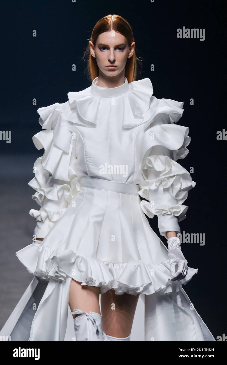 A model walks the runway wearing a creation by David Moss during the ...