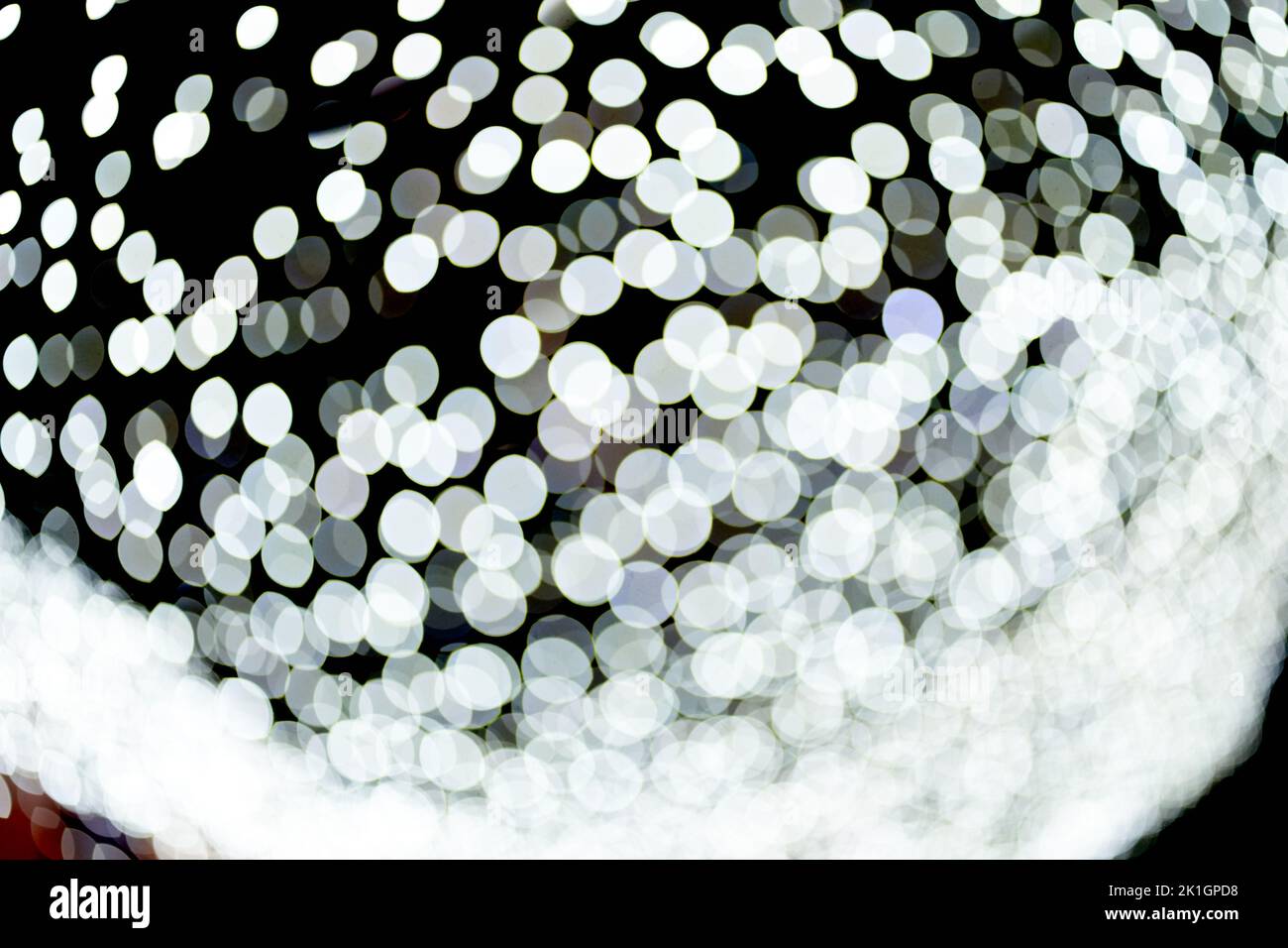 Abstract background of flickering lights with a side of unfocused white ...