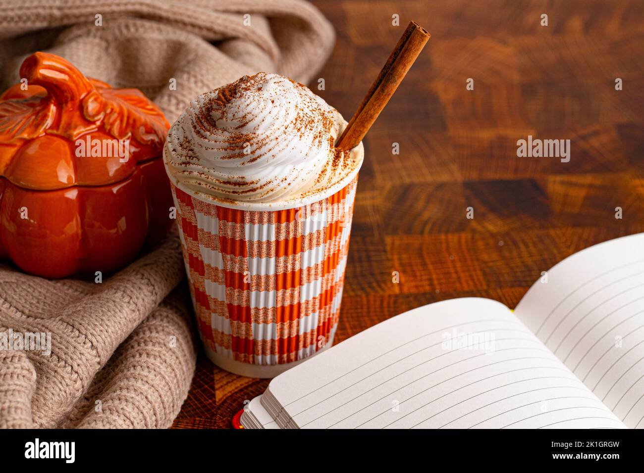 A Pumpkin Spice Latte Topped with Whipped Cream in a Disposable Cup on ...