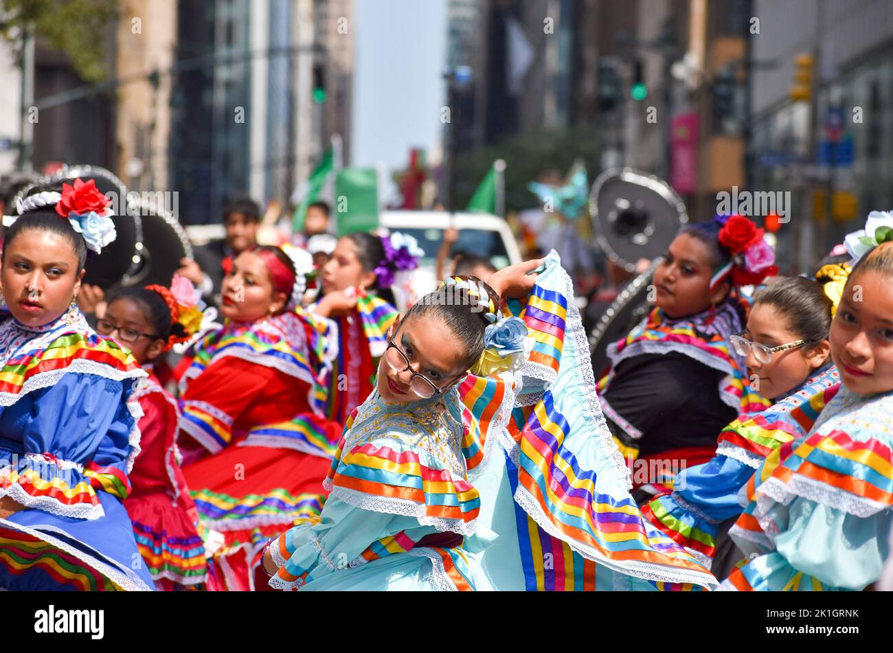 Participants are performing folklore dance along Madison Avenue, New ...