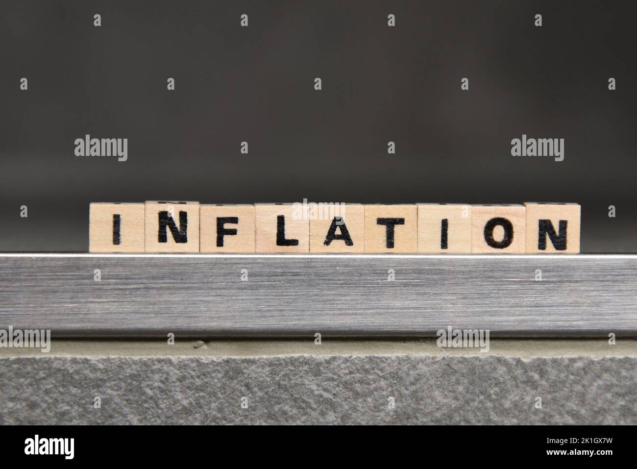 the word inflation with wodden bricks and a euro bank note Stock Photo ...