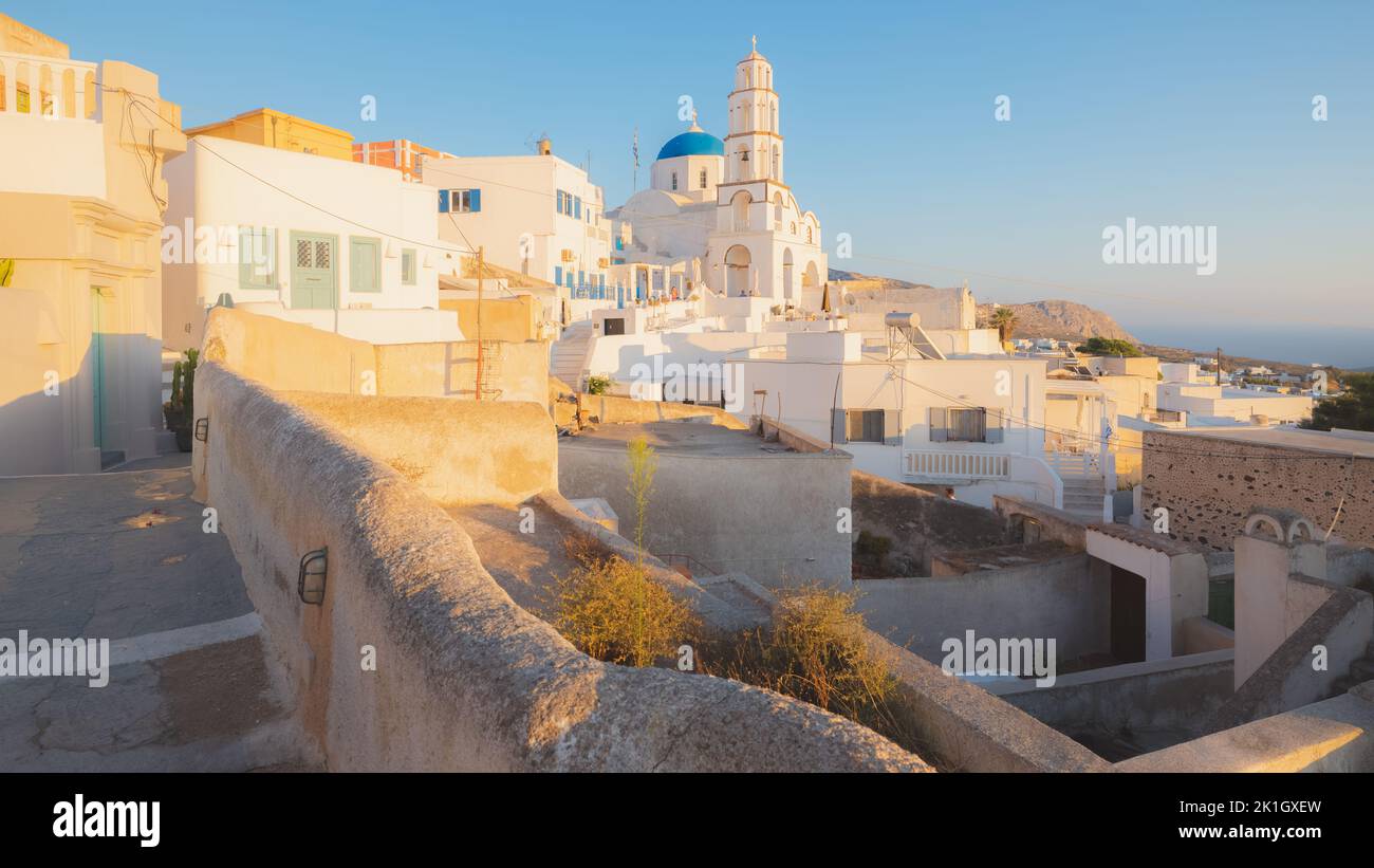 An illuminated footpath leads to the traditional blue dome Greek ...