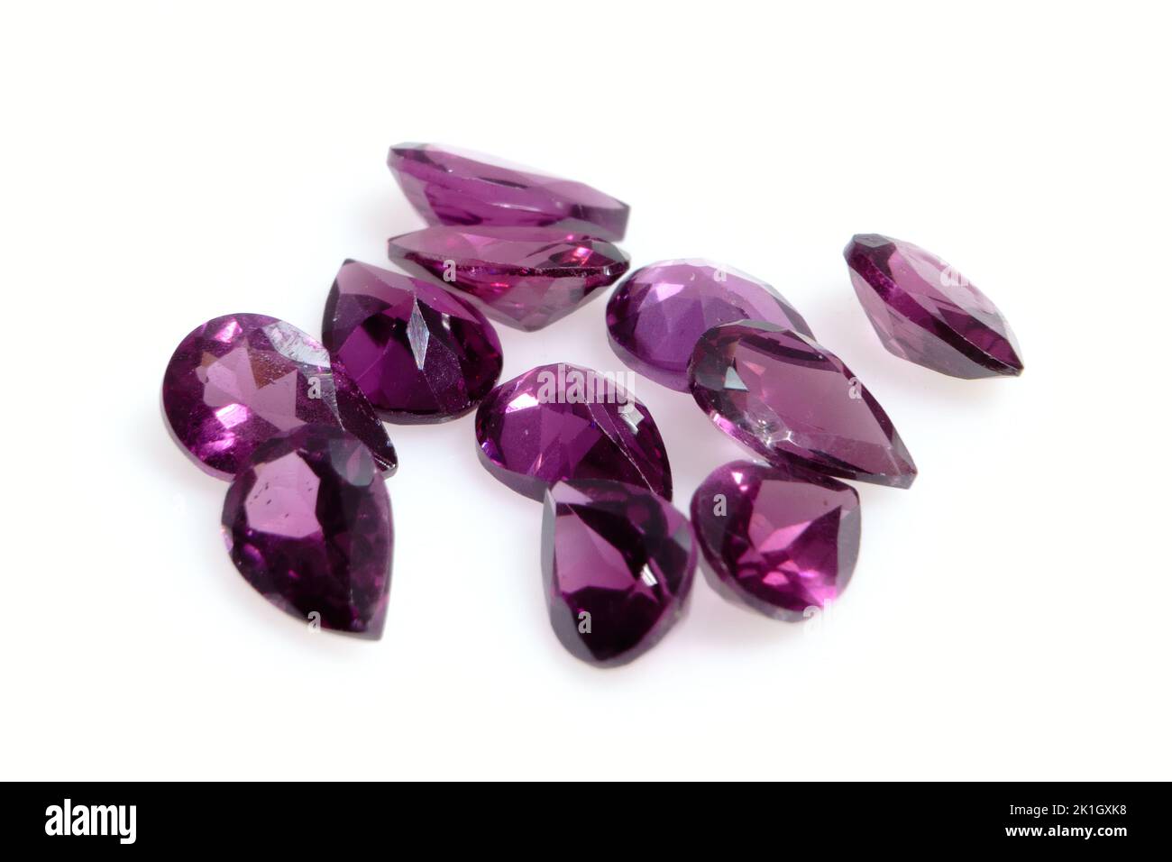 Natural gemstone pink rhodolite garnet on gray background Stock Photo ...