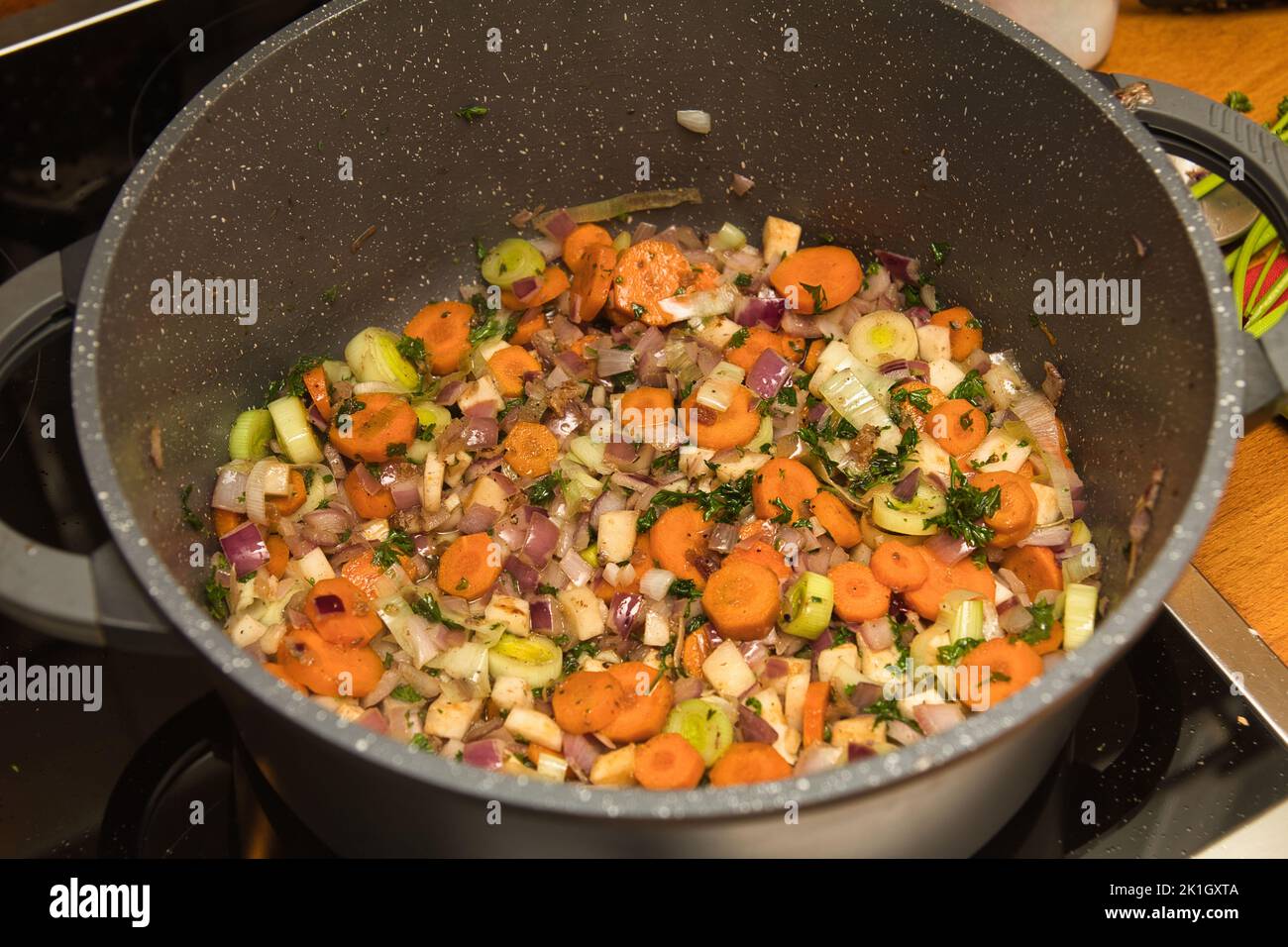 Root vegetables sauté for a sauce Stock Photo - Alamy