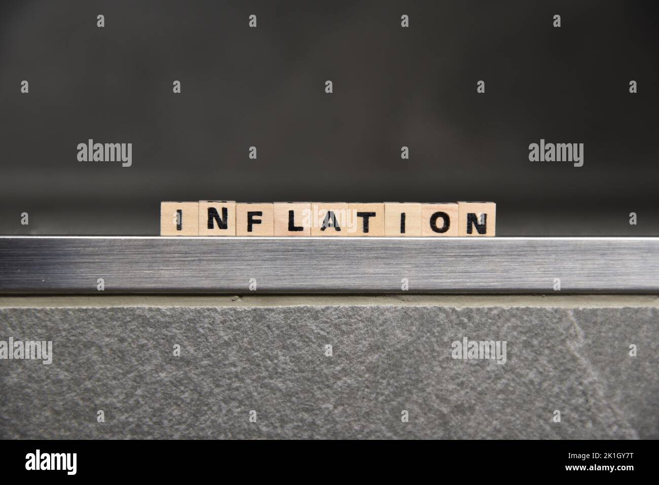 the word inflation with wodden bricks and a euro bank note Stock Photo ...
