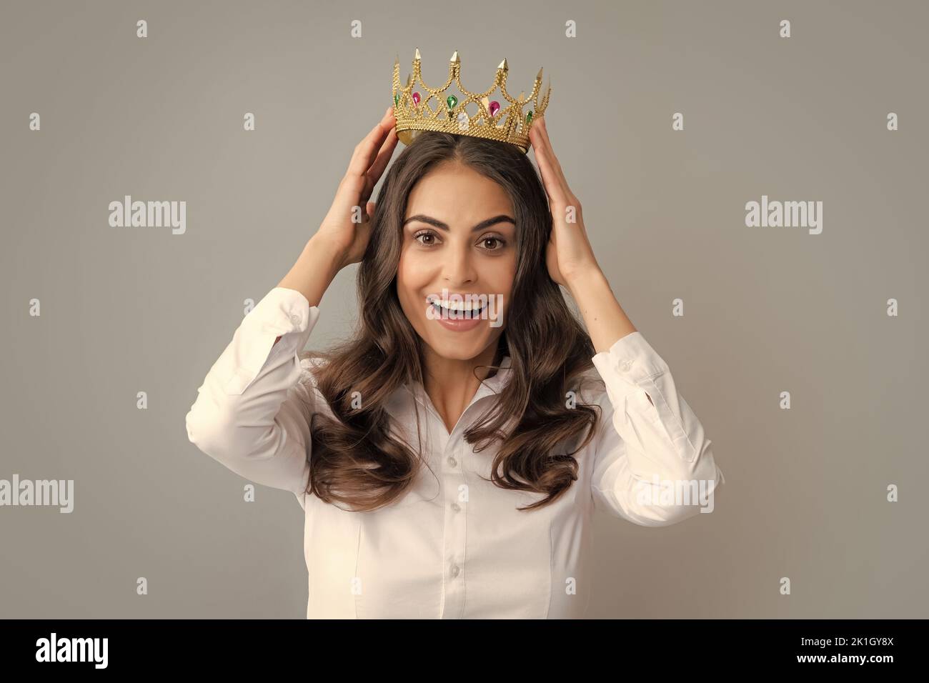 Portrait of arrogance woman with golden crown on head, leadership and ...