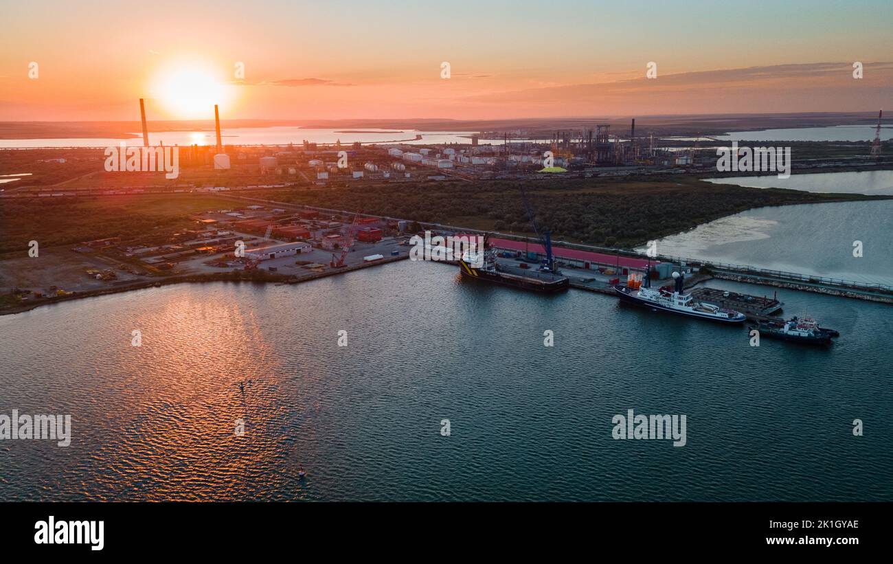 Aerial view of a harbor with ships sailing and docked. Photography was ...