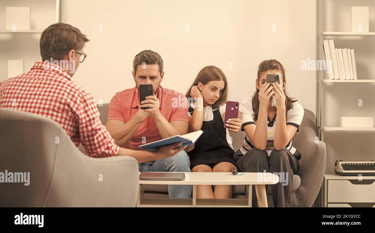 parents with kid talk to social worker. phone addicted mom dad and ...