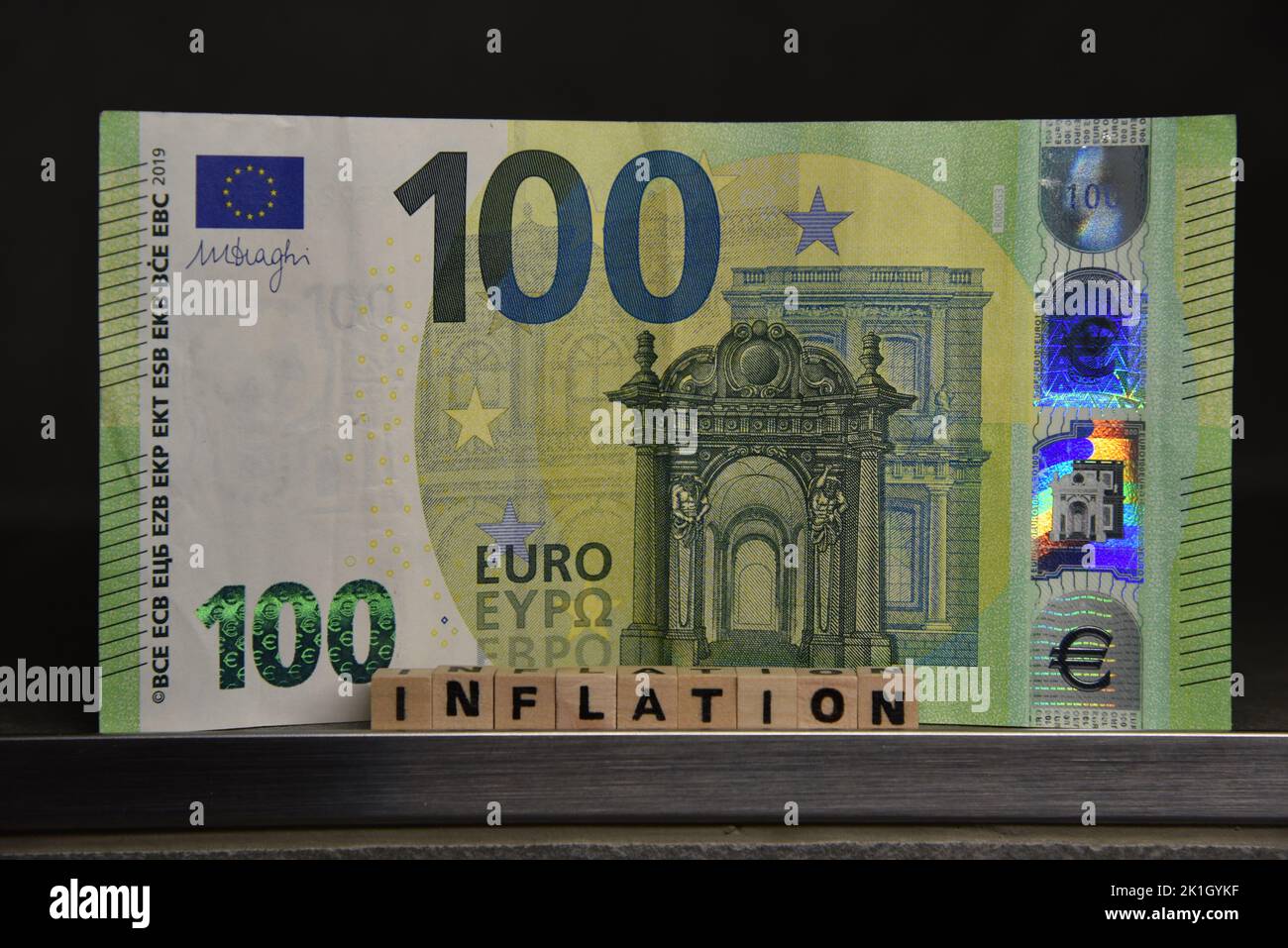 the word inflation with wodden bricks and a euro bank note Stock Photo ...