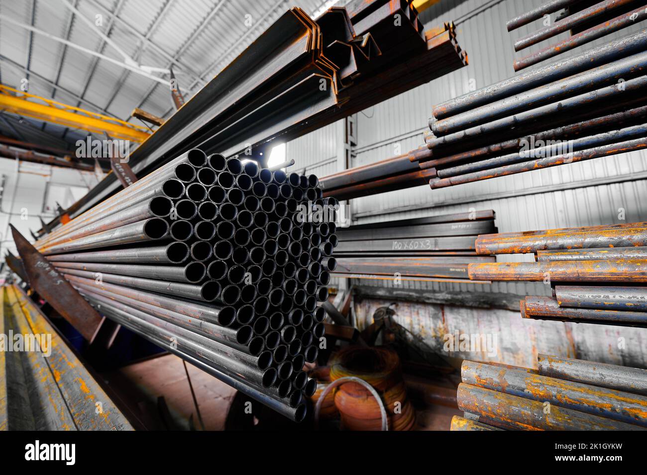 Cold rolled pipes stacked on shelving unit in plant storage Stock Photo ...