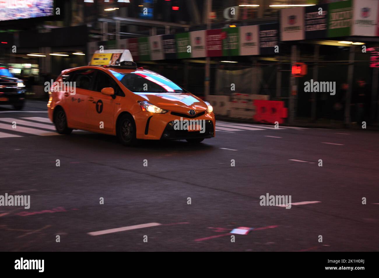 A yellow Toyota Prius Taxi driving at Timesquare in New York, USA Stock ...