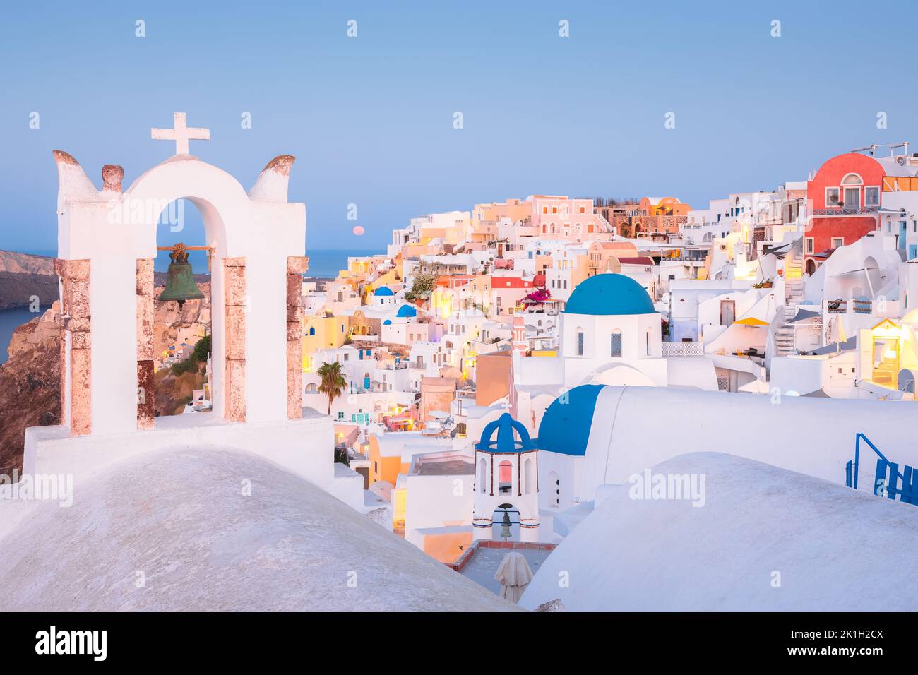 Seaside view at blue hour of traditional white wash buildings and blue ...