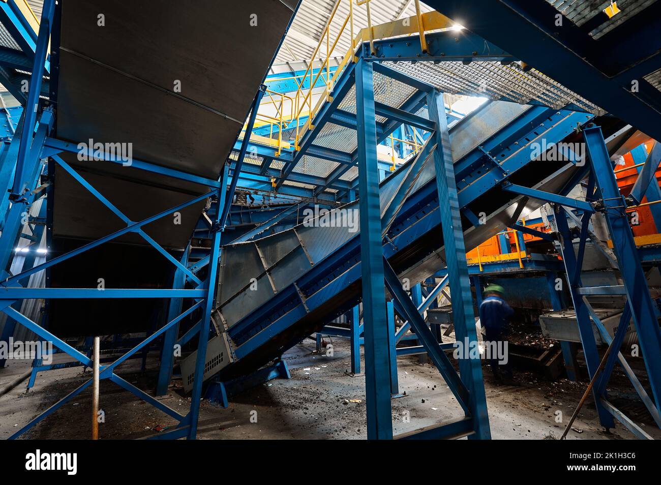 Complex system of inclined belt conveyors. Waste sorting plant Stock Photo - Alamy