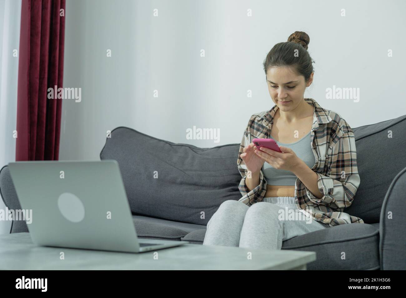 Close-up of a girl using a laptop. In your free time. Learning online ...
