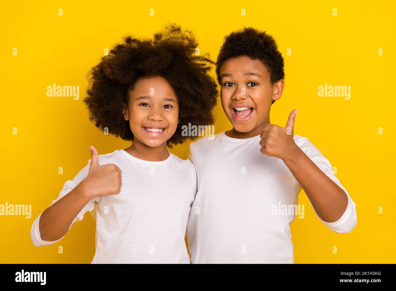 Photo of two little buddies hand finger demonstrate thumb up feedback ...