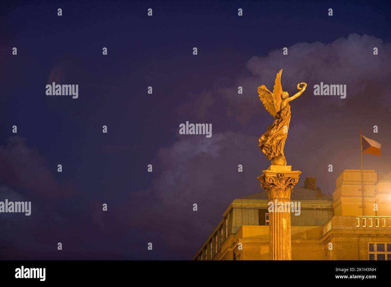 statue near Rudolfinum concert hall at night in Prague, Czech Republic ...