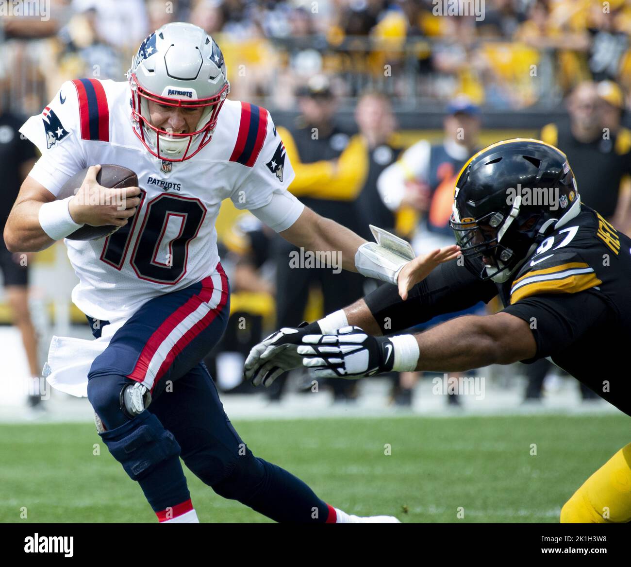 New England Patriots quarterback Mac Jones (10) scrambles for two yard ...