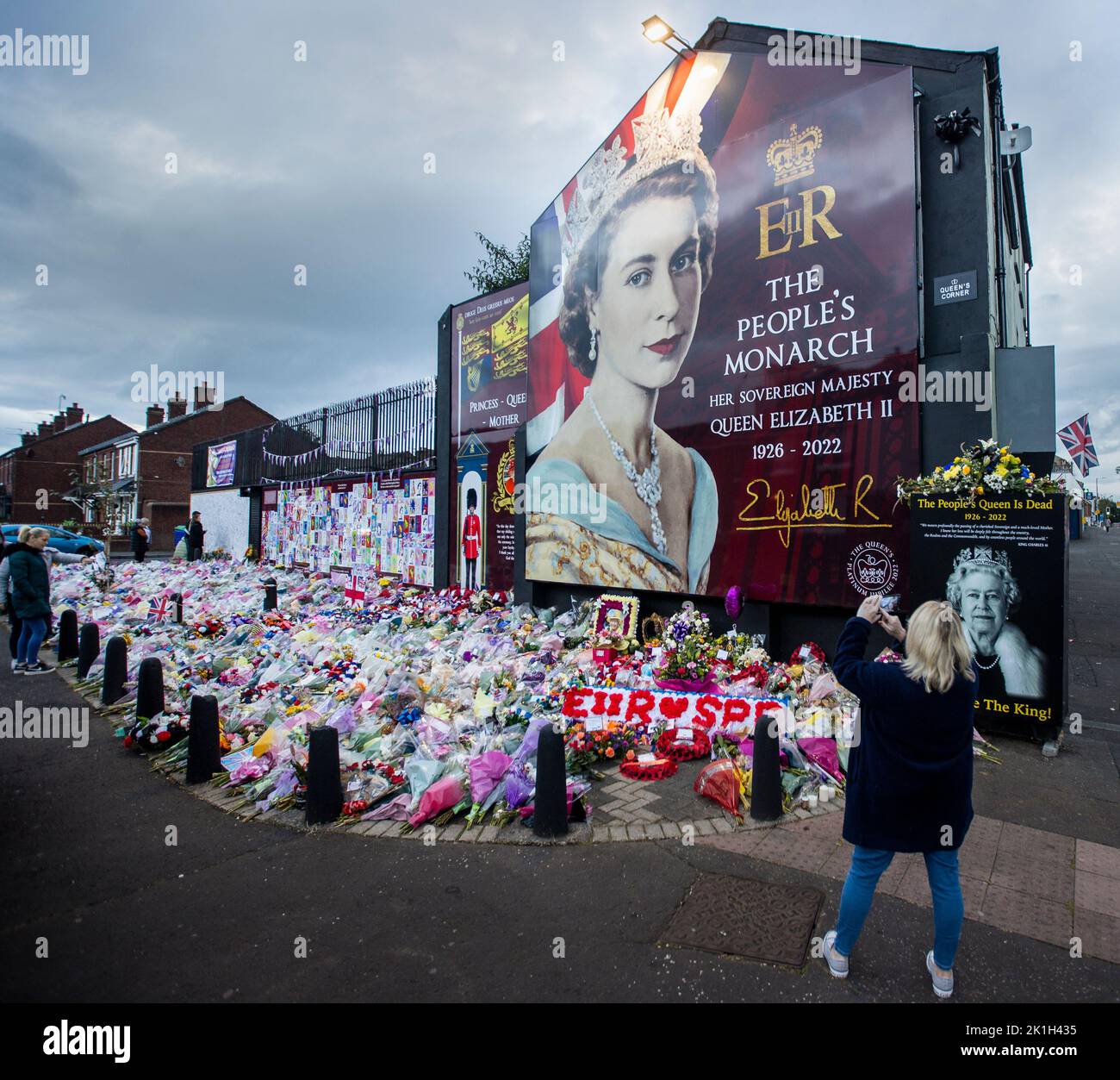 Members of the public visit a mural to Queen Elizabeth II on the ...