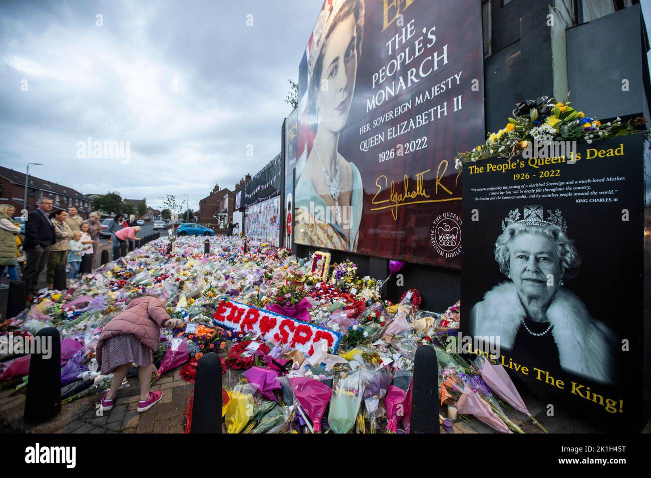 Members of the public visit a mural to Queen Elizabeth II on the ...