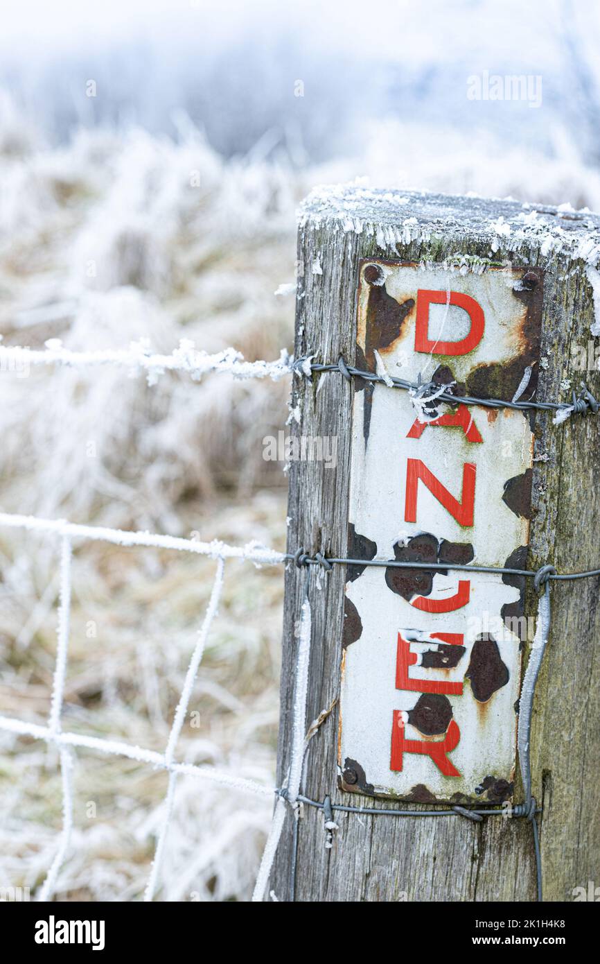 Danger sign on fence, Scotland Stock Photo - Alamy