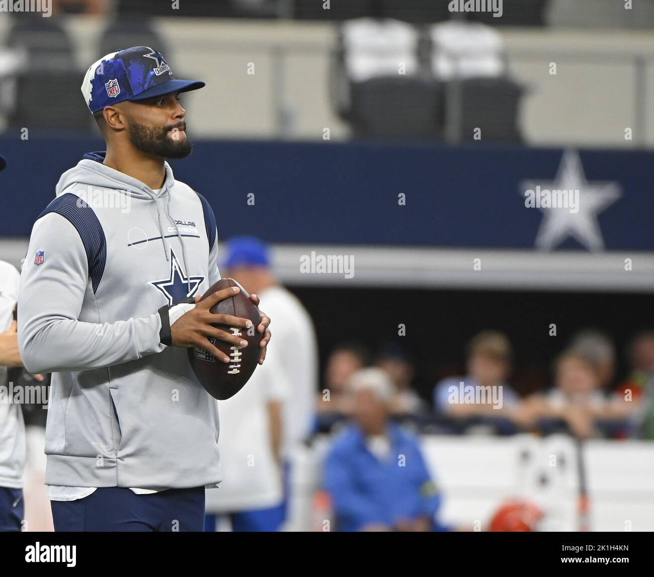 Dallas Cowboys quarterback Dak Prescott, wearing a hand cast, watches ...