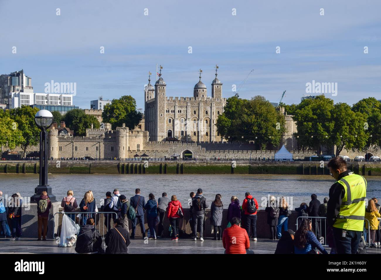 Mourners pass by the Tower of London as they continue to queue near ...