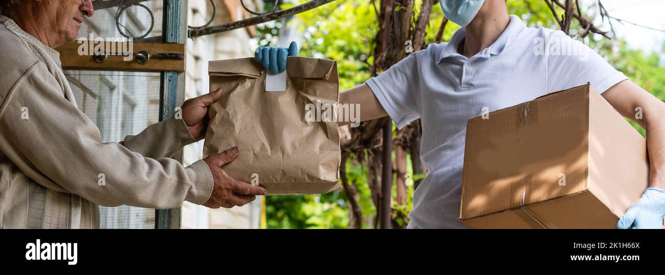 Giving groceries to old people hi-res stock photography and images - Alamy