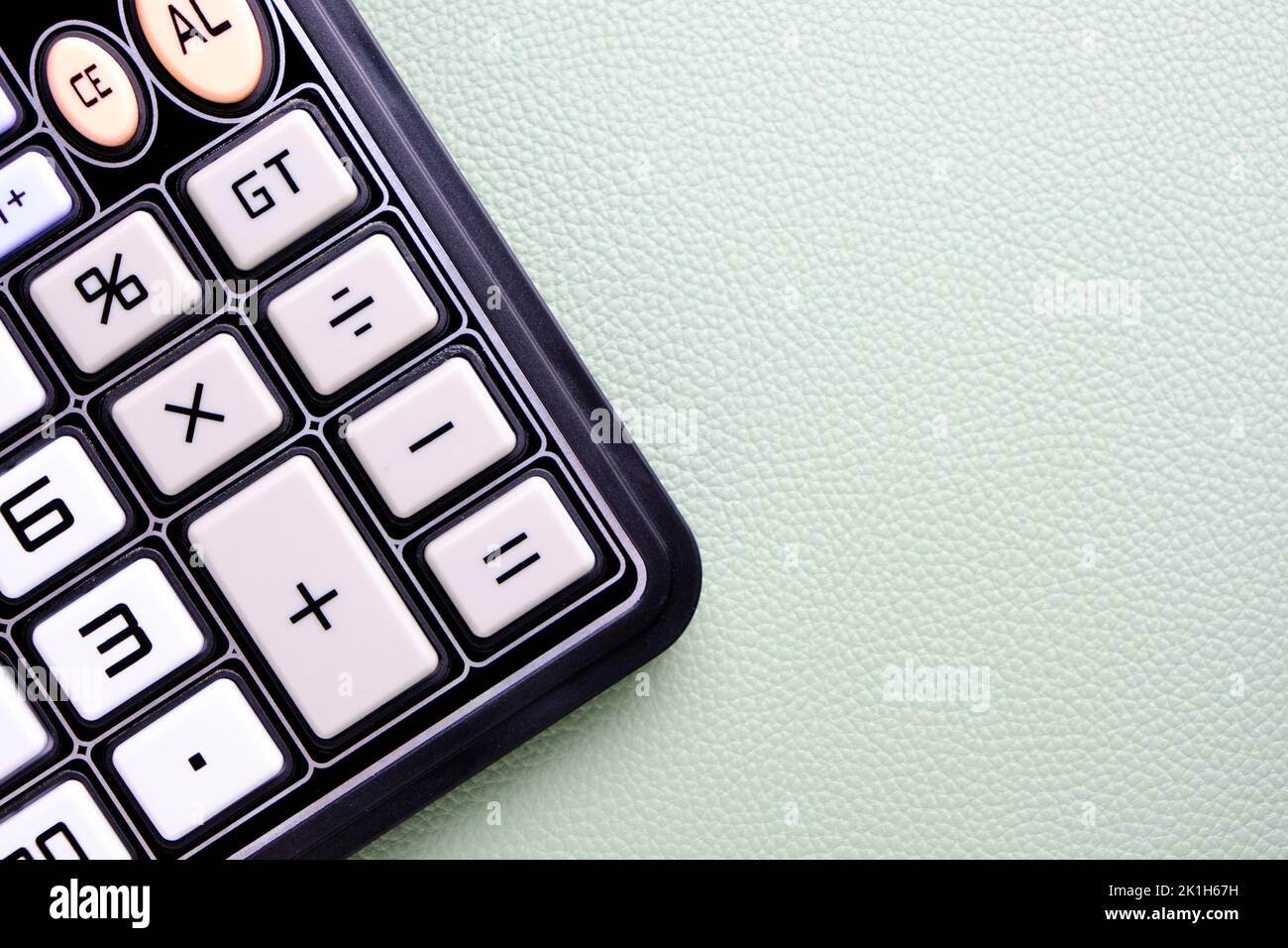 Calculator on table with skin texture background Stock Photo - Alamy