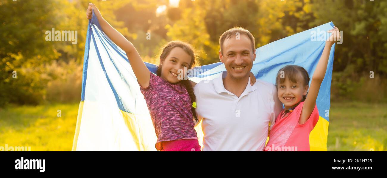 happy family with flag of ukraine in field. lifestyle Stock Photo - Alamy