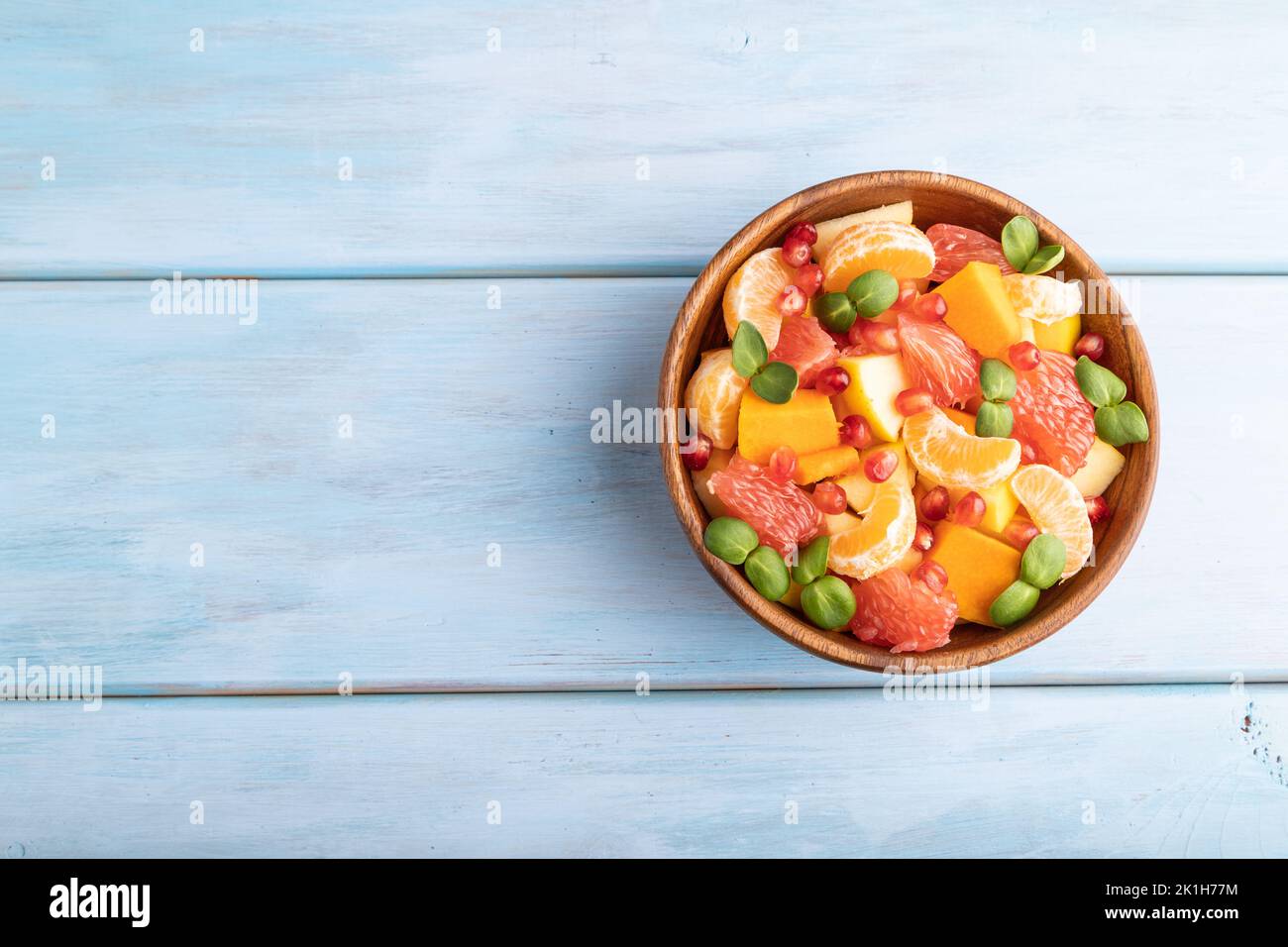 Vegetarian fruit salad of pumpkin, tangerine, pomegranate, grapefruit ...
