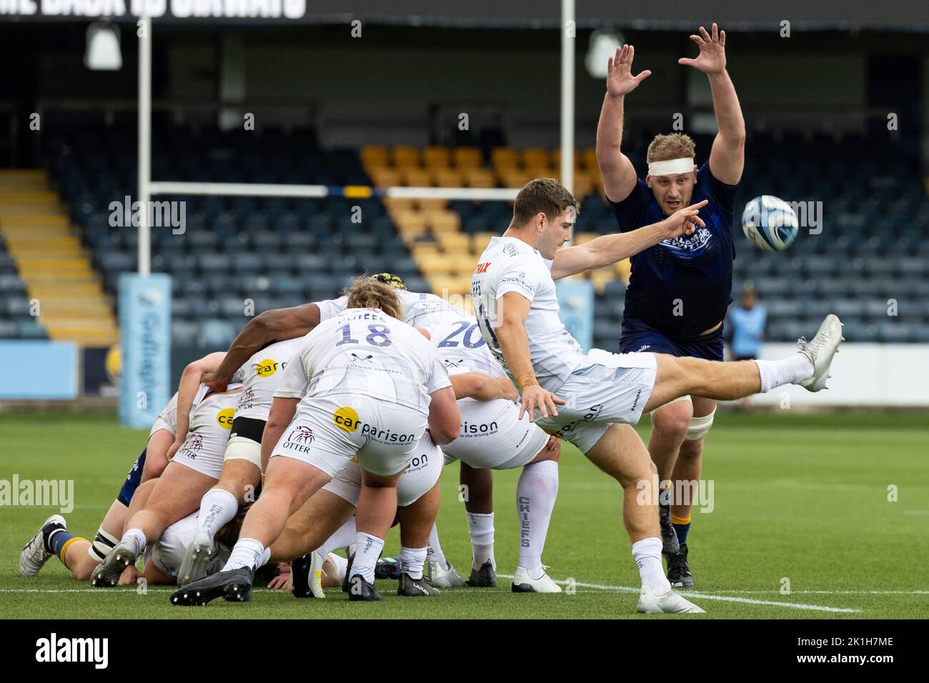 Jack Maunder of Exeter Chiefs box kicks, as Joe Batley of Worcester ...