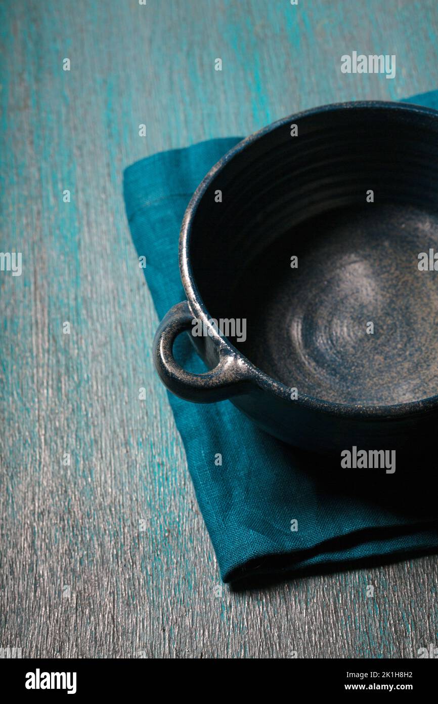 Empty blue deep handmade soup bowl on blue background Stock Photo - Alamy
