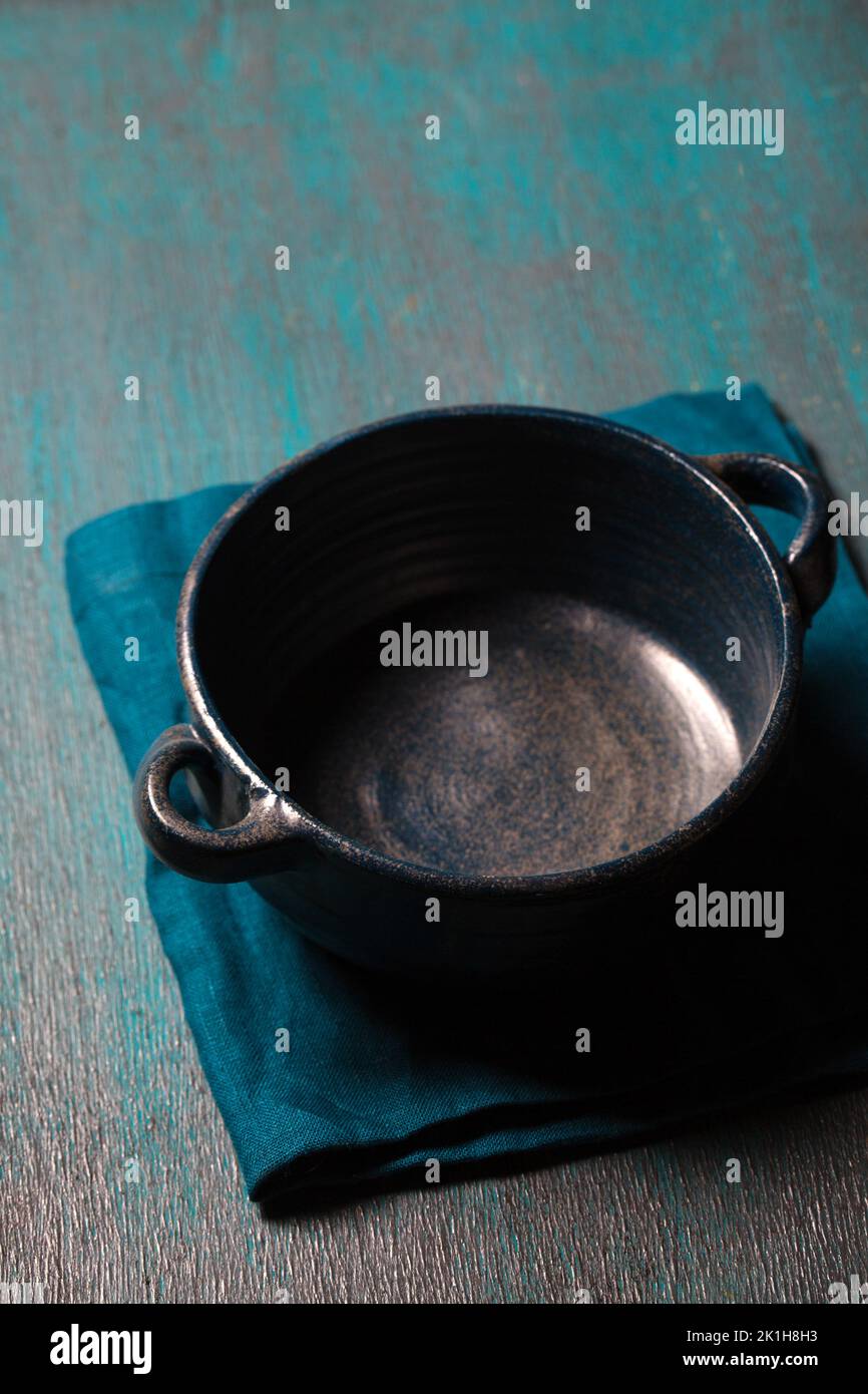 Empty blue deep handmade soup bowl on blue background Stock Photo - Alamy