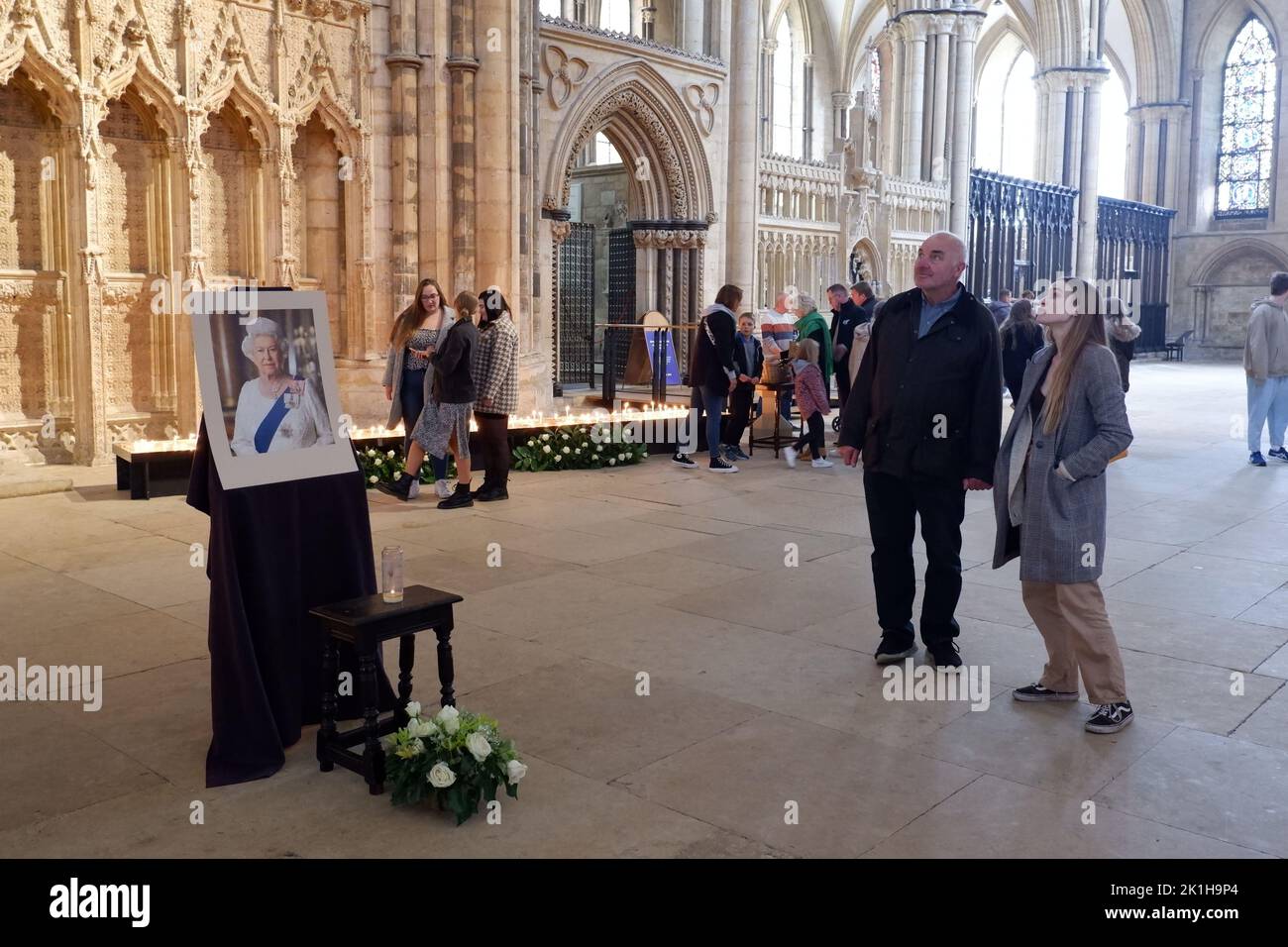 Members of the public view a display commemorating Queen Elizabeth II ...