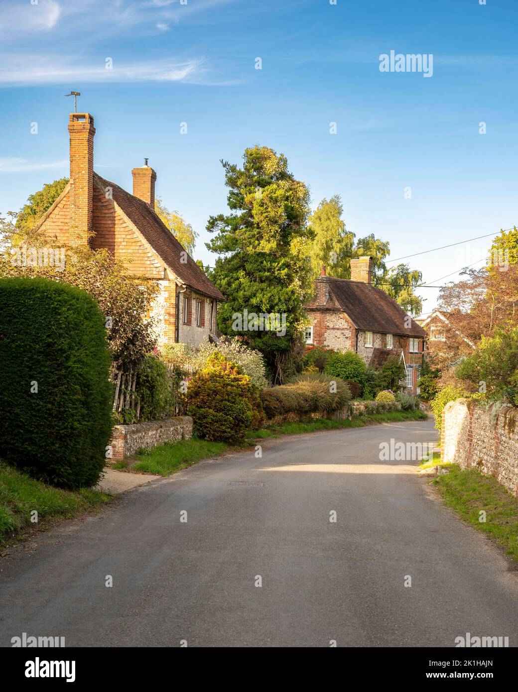 Flint and brick built cottages in the village of Graffham on an early ...
