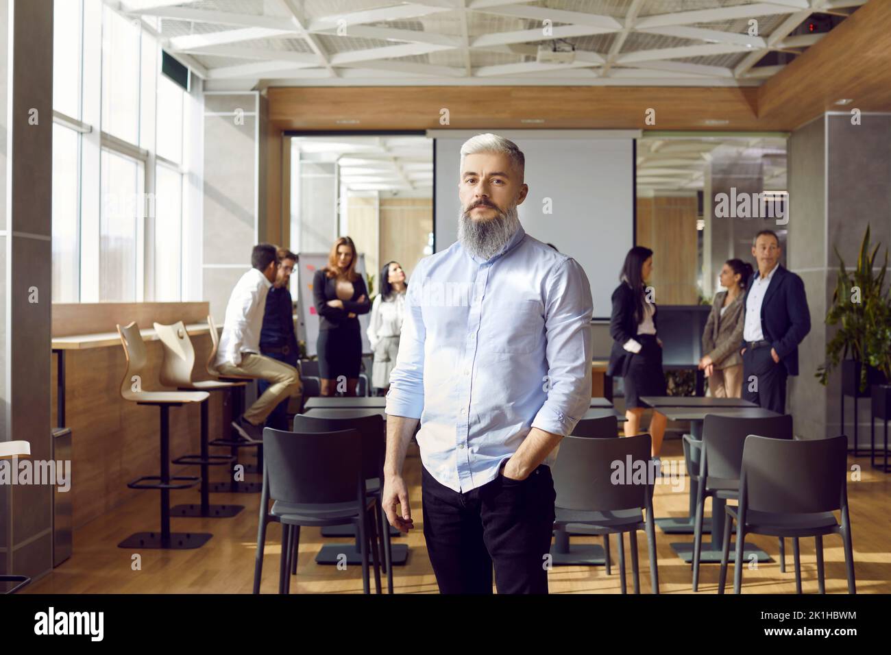 Professional team coach and business teacher standing in office after ...