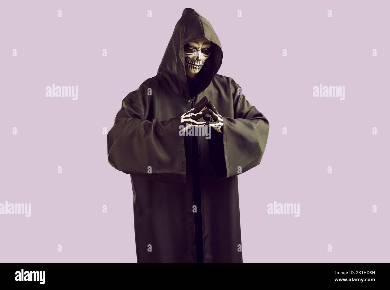 Man in scary Halloween costume of Mr Death standing isolated on light ...