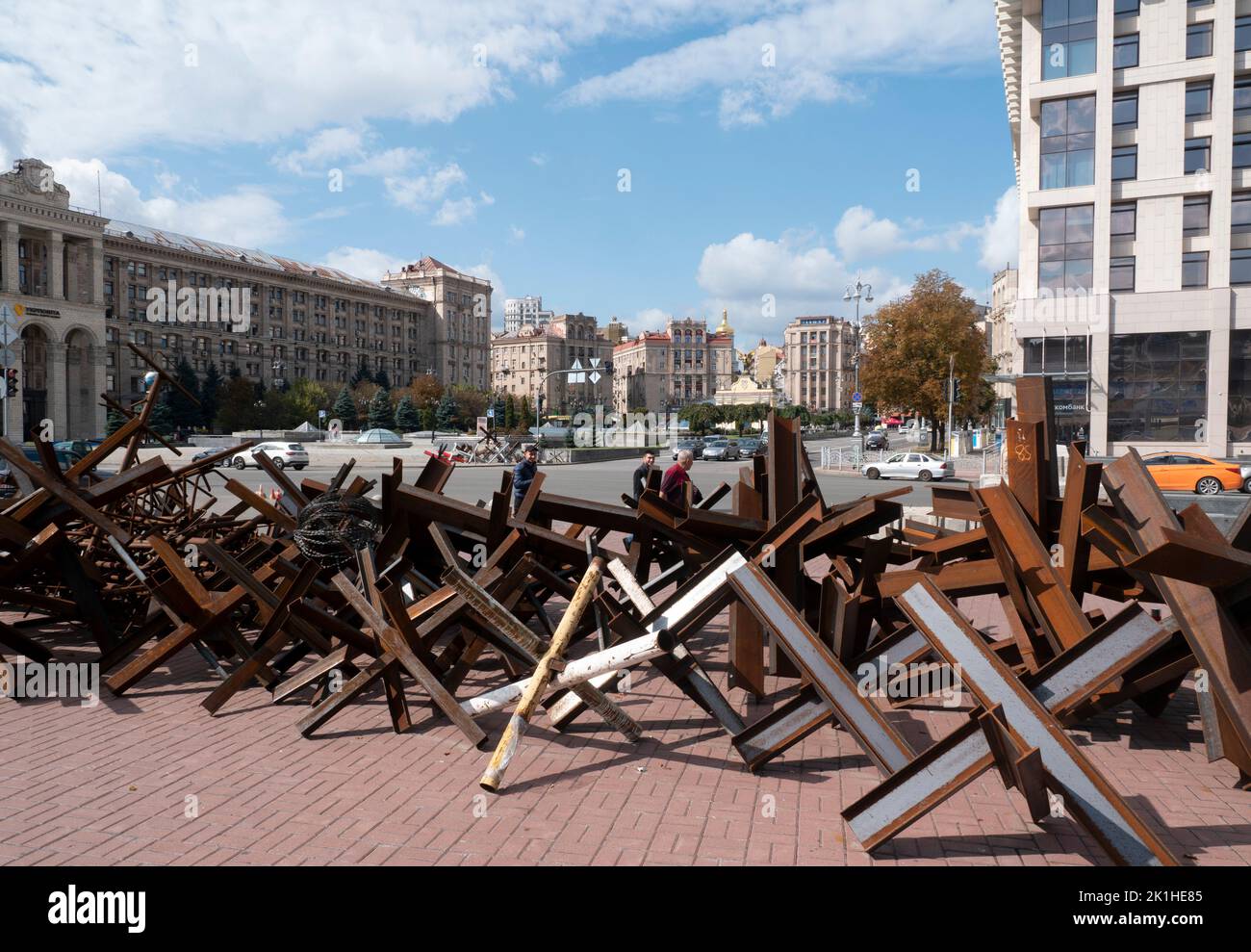 People walk past tank obstacles at Independence Square in Kyiv, Ukraine ...