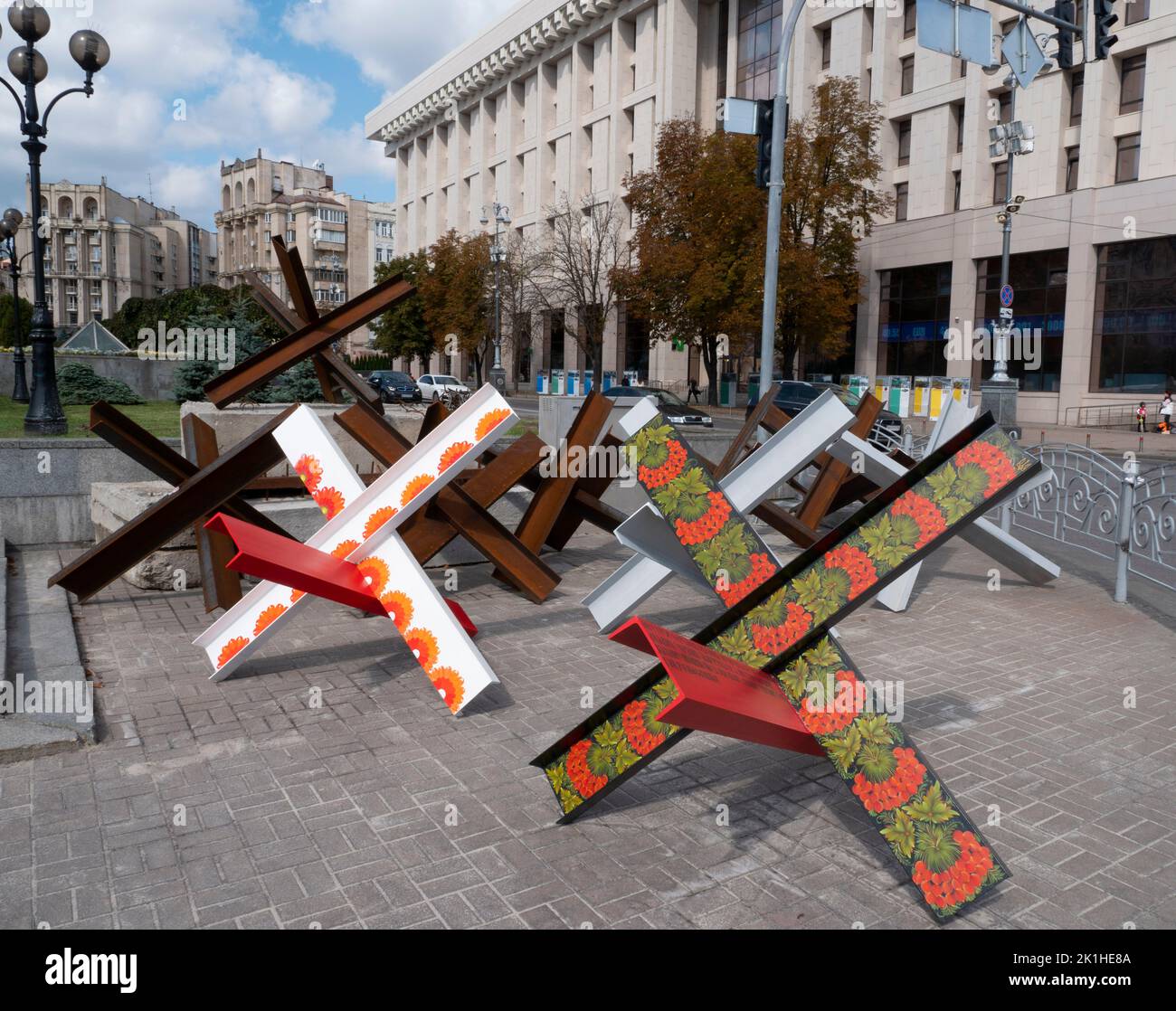 People walk past tank obstacles at Independence Square in Kyiv, Ukraine ...