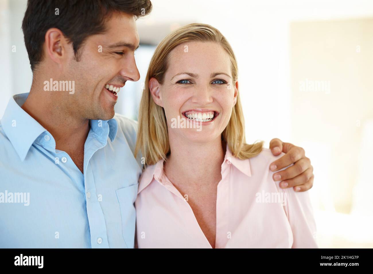 Each day she becomes more beautiful. a handsome man looking lovingly at ...