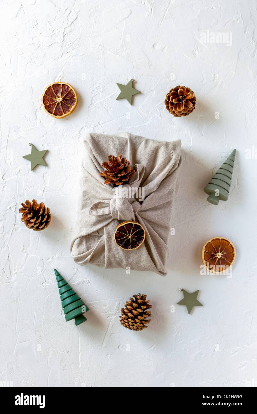 Christmas gift packed in textile, with the natural materials decoration ...