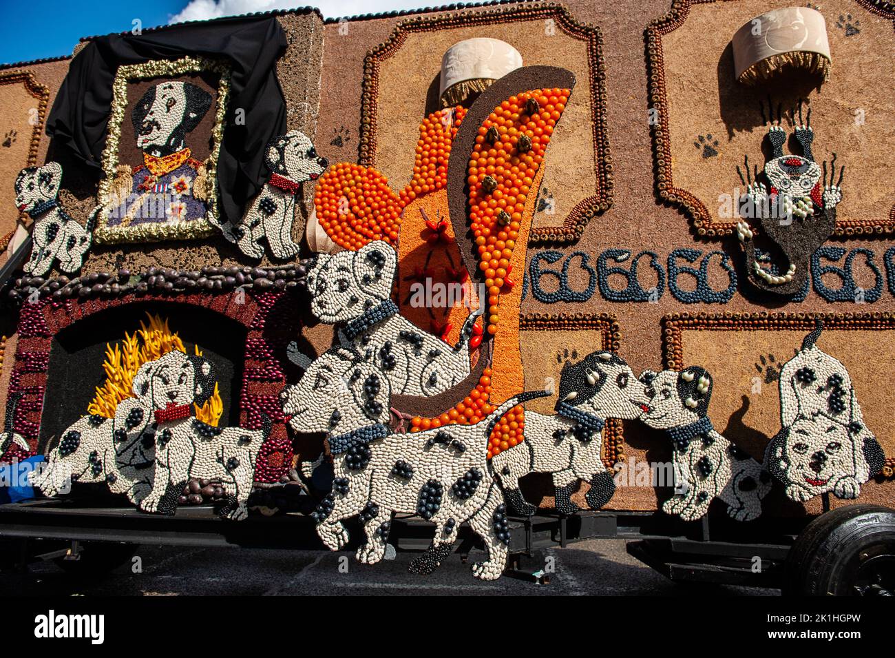 One of the floats is seen decorated with a scene from the Disney movie ...