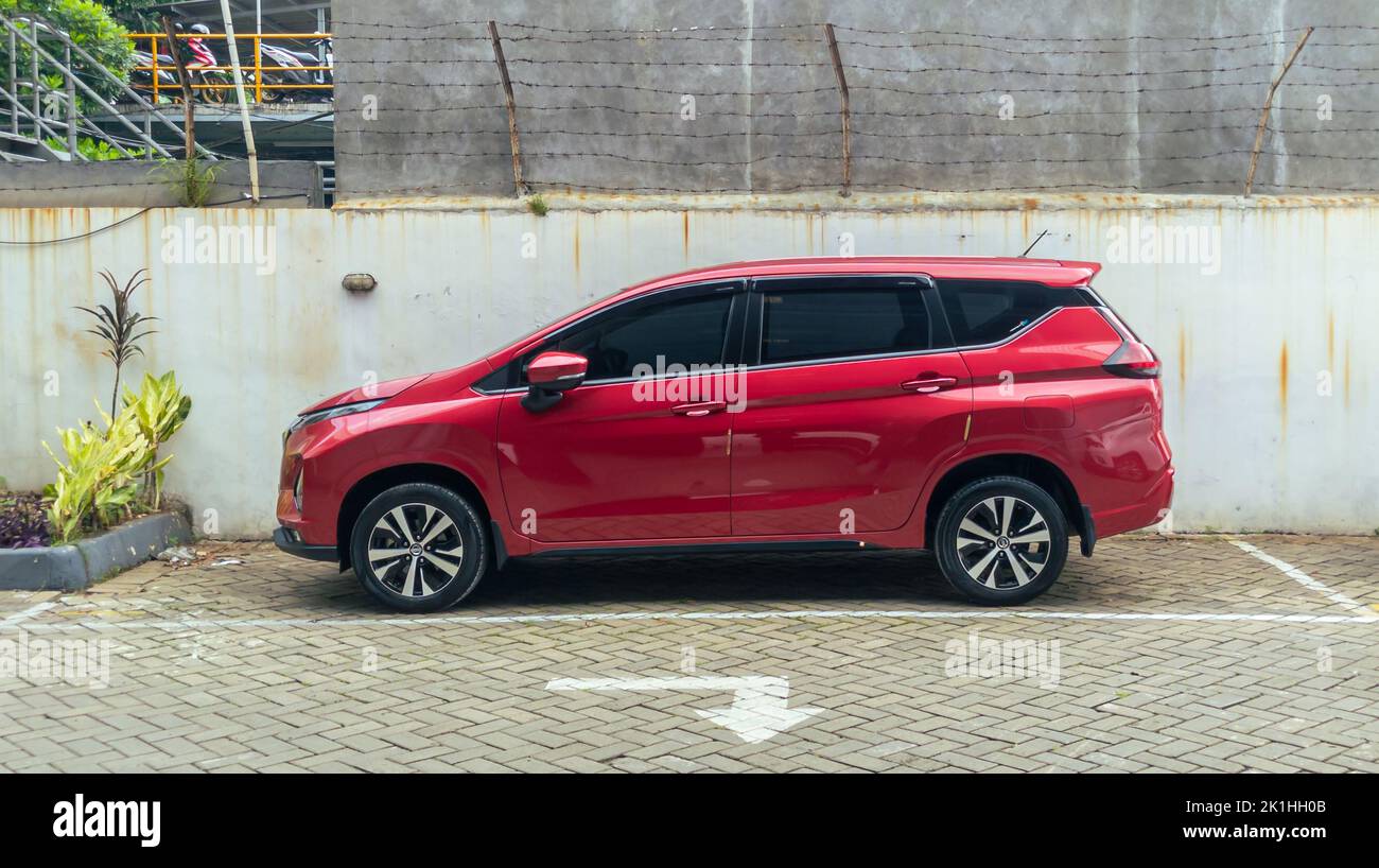 a red minibus parked in the parking area, jakarta, indonesia, September ...