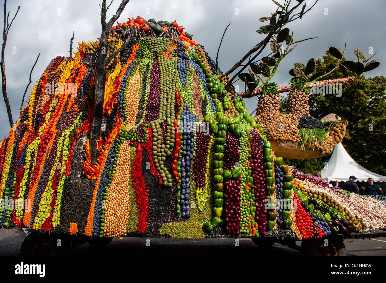 One of the fruit floats is seen passing in front of a big audience. The ...