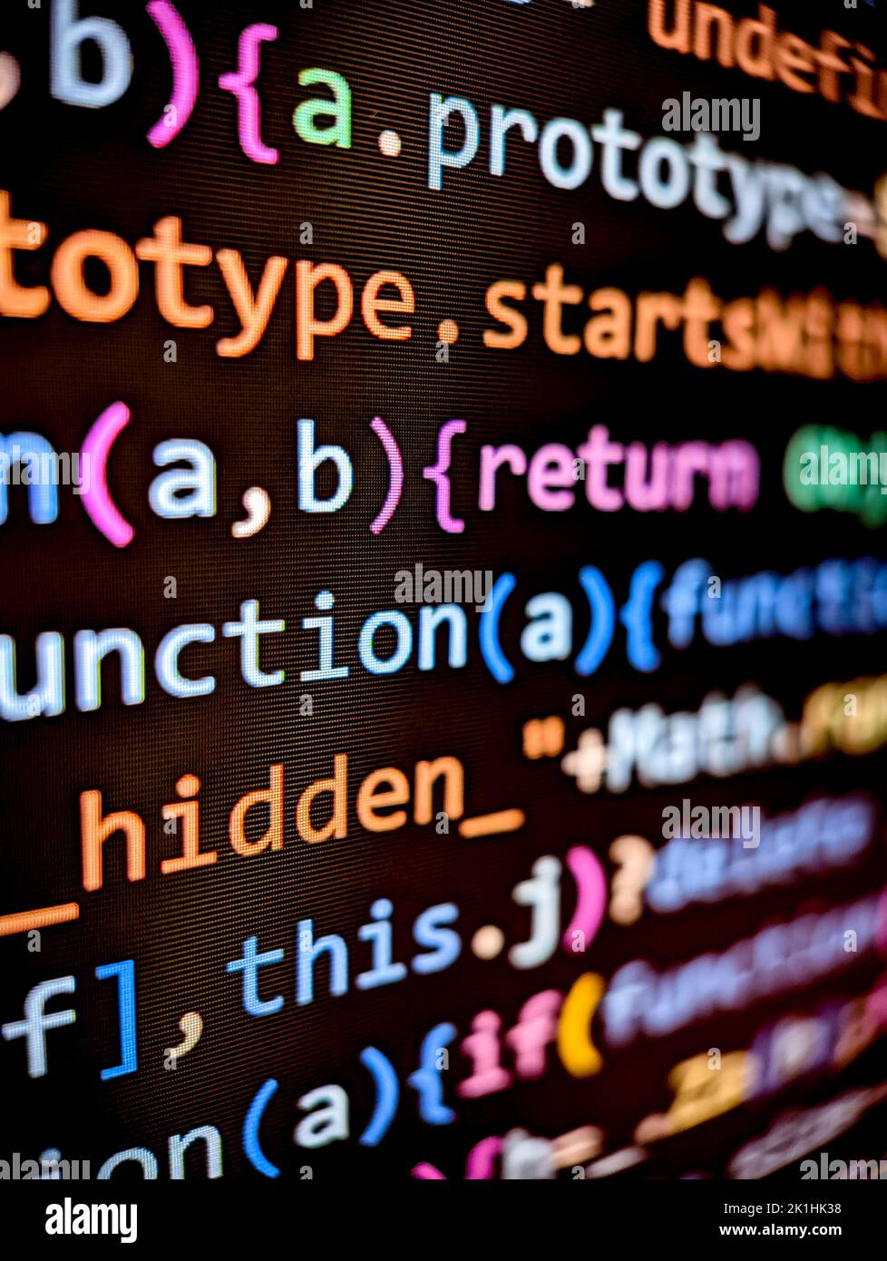 Computer code displayed on pixelated screen with colorful characters on ...