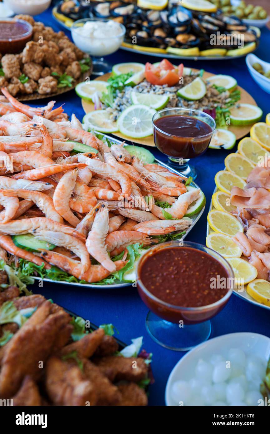 Selection of cold bites, predominantly seafood, meats and salads at a ...